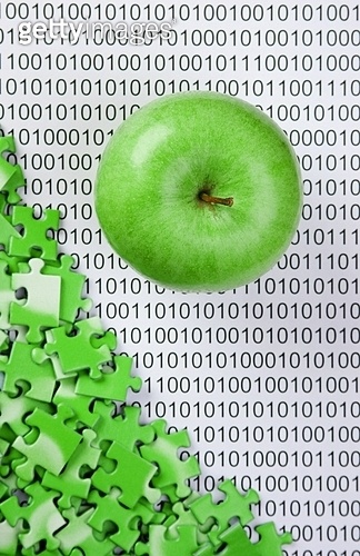 green apple and puzzles on a binary code (a10894801) - 게티이미지뱅크