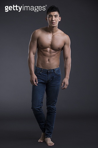 Portrait of young Chinese muscular man (a11095062) - 게티이미지뱅크