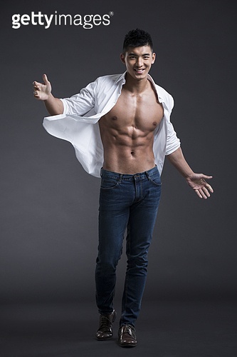 Portrait of young Chinese muscular man (a11095079) - 게티이미지뱅크