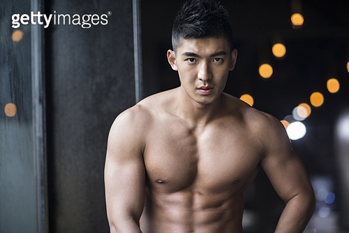 Portrait of young Chinese muscular man (a11095091) - 게티이미지뱅크