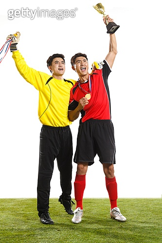 Football players celebrate success 이미지 (vs11131878) - 게티이미지뱅크