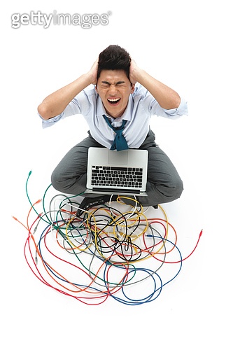 When using computer business man hands scratching his head (vs11151113 ...