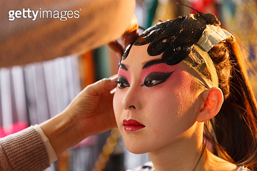 The stylist for the Peking Opera actors doing hair style (vs11152625 ...