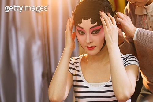 The stylist for the Peking Opera actors doing hair style (vs11152651 ...