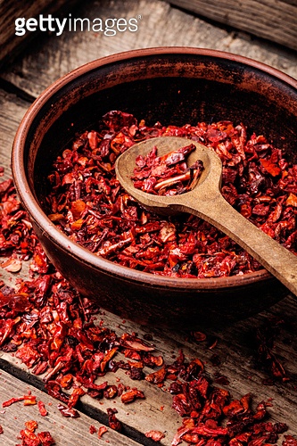 Sweet red sliced pepper as seasoning.Indian spices.Paprika powder. Heap ...