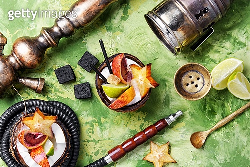 hookah with taste of tropical fruits. Smoking Shisha with the scent of ...