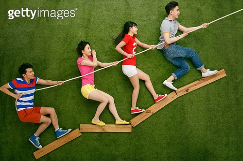 The climb up young men and women on the grass 이미지 (vs12452232) - 게티이미지뱅크