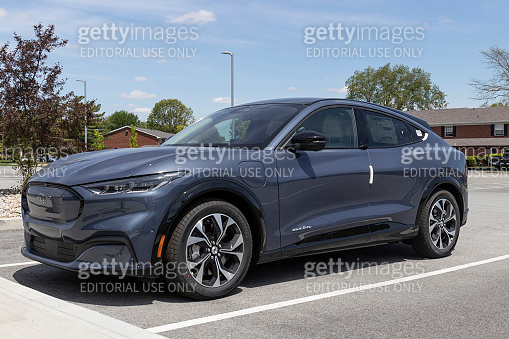 Ford Mustang Mach-E SUV display at a charging station. The Mustang Mach ...