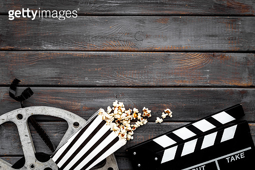 Layout of film reel with popcorn and clapperboard. Cinema concept ...
