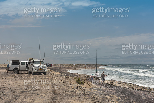 Surf fishing on the Skeleton Coast in the north of Swakopmund, Namibia ...
