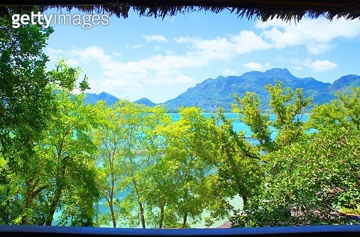Summer window view on tropical paradise island, blue ocean, mountains ...