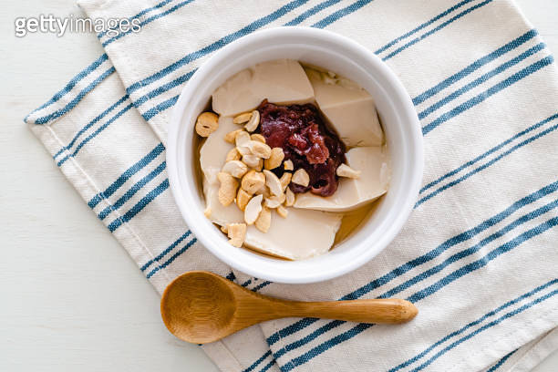 Taiwan dessert soft bean curd, or known as "toufa" (tofu pudding) with ...