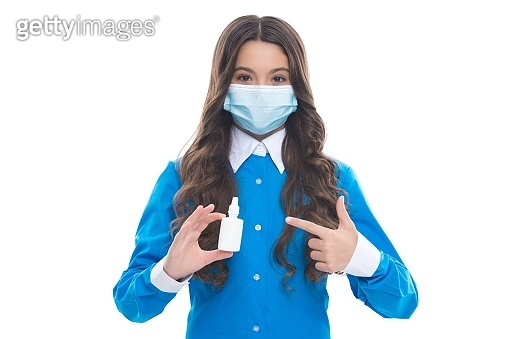 kid in respirator mask with nasal drop or spray for treatment of runny ...