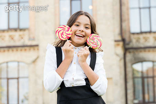 Crazy about sweets. Happy kid with candy. School nutrition. Calories ...