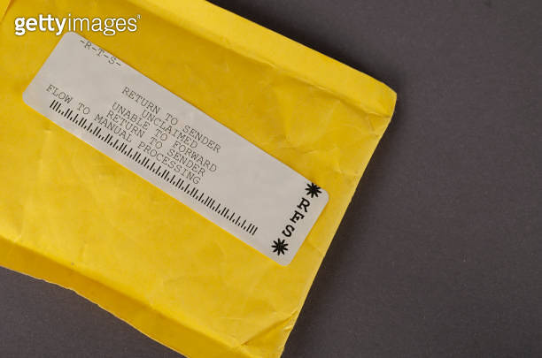 A yellow mail bag that says RETURN TO SENDER. 이미지 (1305932625) - 게티이미지뱅크