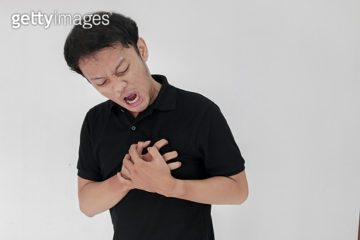 Heart attack or broken heart of young asian man with hurt emotion wear ...