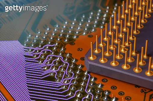 macro photo of printed circuit board with illuminated wires, pin grid ...