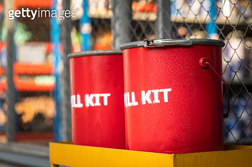 Spill kit containment boxes are prepared and placed in front of the ...