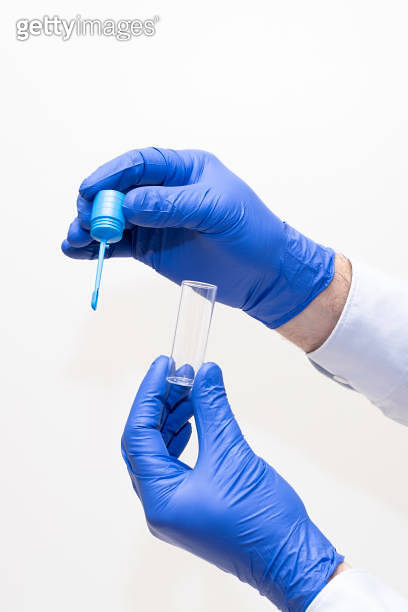 Doctor Hand holding test stool in plastic jars. Medical background ...