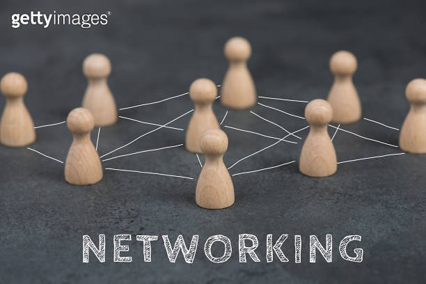 Group of wooden people connecting through white lines,the word ...