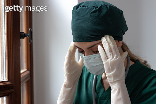 Portrait Of Female Doctor Or Nurse Who Is Exhausted After Work Overload ...