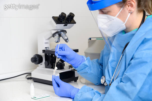 Covid-19 nasal swab laboratory test in hospital laboratory. High ...