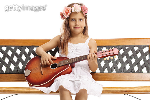 Little girl sitting on a bench and playing a mandolin 이미지 (1295500934 ...