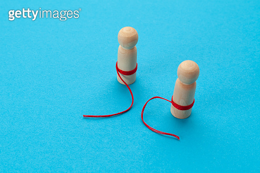 Two figures with a broken red thread. Breakup in relationships, family ...