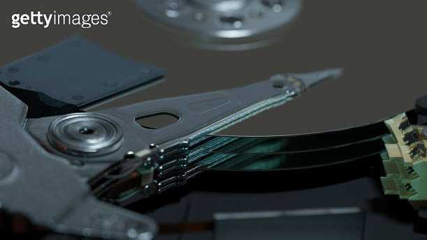 Close-up on a modern HDD or Hard Disk Drive with shallow depth of field ...