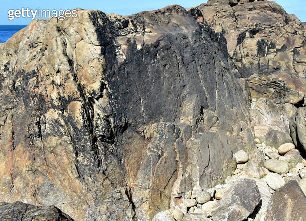Rocks with oil spill from the sinking of oil tanker MV Prestige in 2002 ...