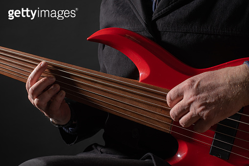 Male musician playing six-string fretless bass guitar 이미지 (1305937865 ...