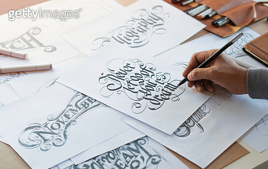 Typography Calligraphy artist designer drawing sketch writes letting ...