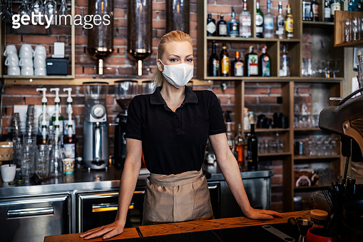 The waitress for the counter waiting to order beverages Portrait of a ...
