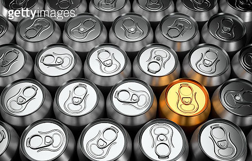 Unique golden can among group of silver recyclable cans cans. View from ...