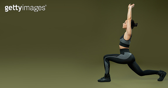 Website header of Sporty young woman doing exercise in studio ...