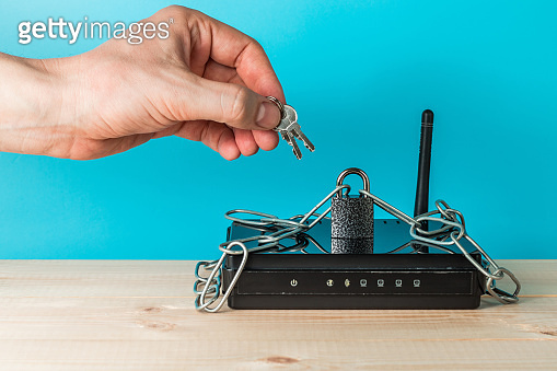 Hand with keys, lock locked with a chain on wifi router 이미지 (1307806602 ...