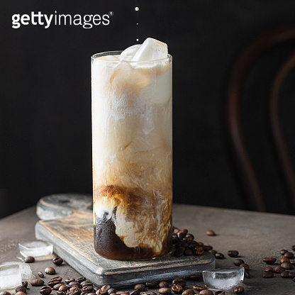 Cold brew coffee with milk shades on concrete background with coffee ...