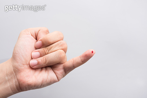 Bleeding blood from the cut finger wound. Injured finger with bleeding ...