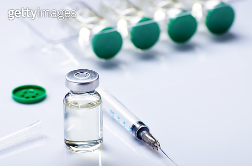 Just opened vial with liquid drug as vaccine ready dose flu shot along ...