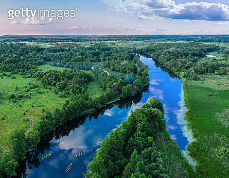 Canoes on the calm river. Top view. Beautiful picture of river and ...
