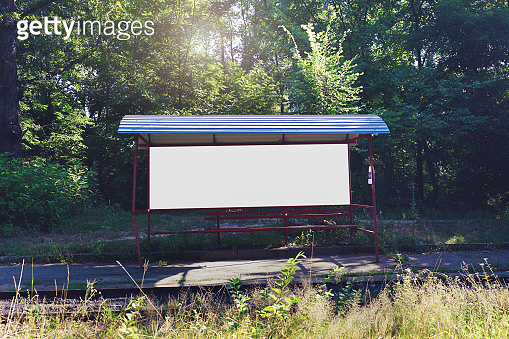 Tram station with white large banner for mockup on sidewalk near ...