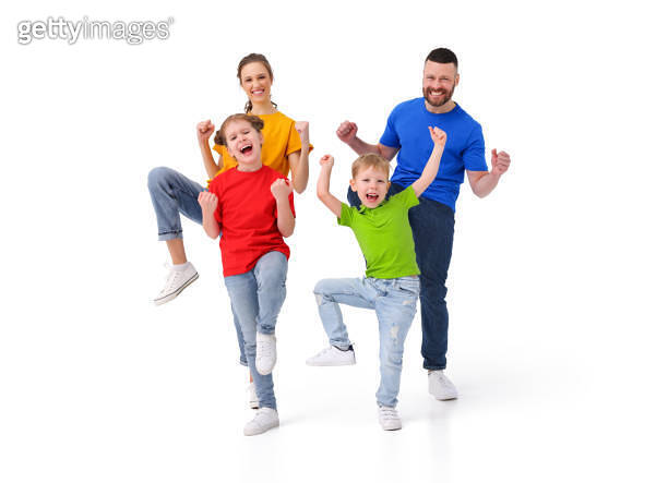Excited family celebrating victory together in studio 이미지 (1299666572 ...