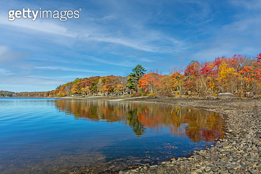Lake Wallenpaupack in Poconos PA on a bright fall day lined with trees ...