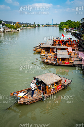 Sightseeing tour on Chinese traditional rowboat in the Dianpu River in ...