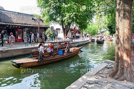 Sightseeing tour on Chinese traditional rowboat along the canal in ...