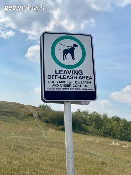 Leaving Off-Leash Area sign. Dogs must be under control on leash and ...