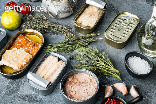 Salmon, tuna, trout mackerel and anchovy - Canned fish in tin cans, on ...