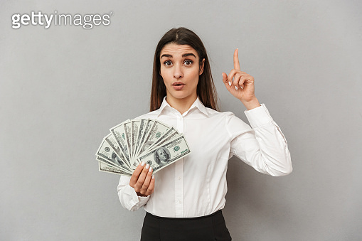 Portrait of rich office woman with long brown hair in business wear ...