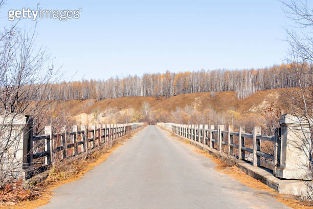 A bridge on the river between two mountains with forests 이미지 ...