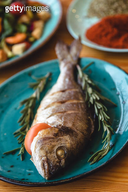 Fresh fish dorado. Dorado and ingredients for cooking on a table. 이미지 ...